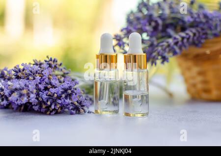 Transparent bottle with lavender oil and fresh lavender flowers Stock ...