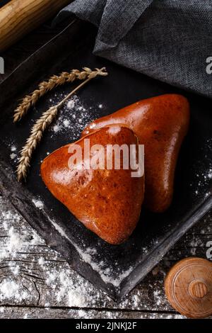 Sweet homemade baked ears. Baking for tea Stock Photo - Alamy