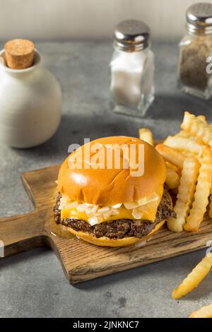 Homemade Wisconsin Butter Burger with Cheese and Fries Stock Photo - Alamy
