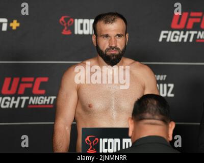 Azamat Murzakanov steps on the scale for the official weigh-ins at ...