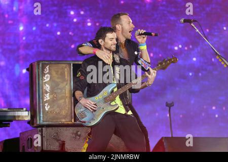 Coldplay performing on stage at Wembley Stadium, north London, during ...