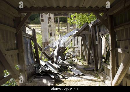 stairs leading to heaven. ruined industrial building on stilts with a ...