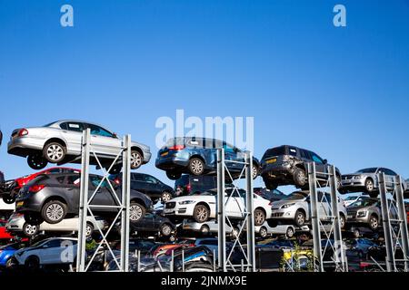 Cars Stacked in Racks Stock Photo - Alamy