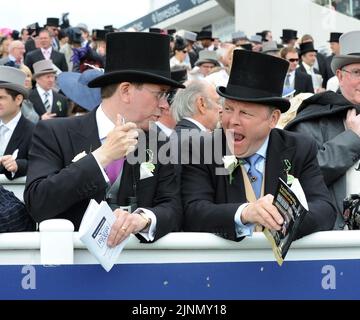 Epsom Derby Day horse racing, the race course, the Grandstand, crowds ...