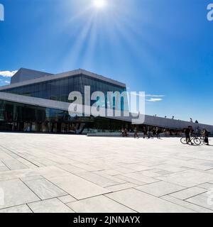Pedestrians on the white forecourt and roof of the opera house in ...