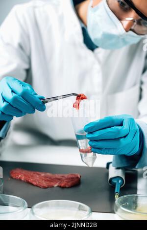 Quality control inspector taking red meat sample Stock Photo - Alamy