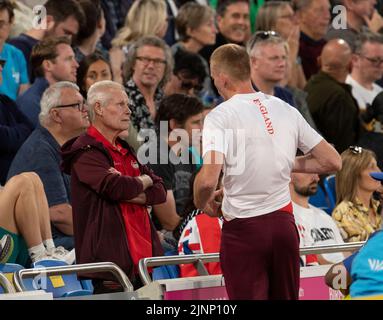 Adam Hague of England talking to his coach Trevor Fox while competing ...