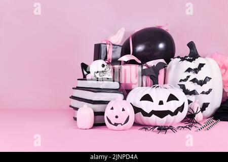 Composition with Halloween pumpkins and paper decor on color wooden ...