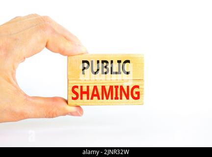 Public shaming symbol. Concept words Public shaming on wooden blocks on ...