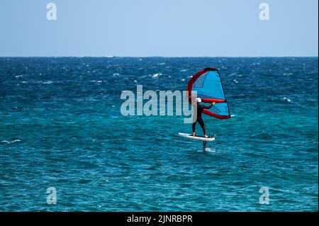 People practicing wing surf or wind foil and windsurf in Costa Teguise ...