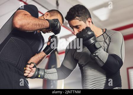 Body shots. two professional fighters sparring in the gym Stock Photo ...