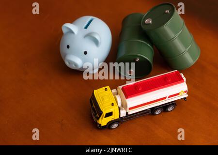 small toy combine with toy oil barrel Stock Photo - Alamy