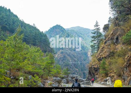 Hikers on the way to Tenzing-Hillary Suspension Bridge, the bridge ...