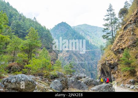 Hikers on the way to Tenzing-Hillary Suspension Bridge, the bridge ...