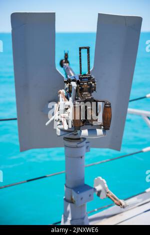 Automated machine gun on the deck of a military ship Stock Photo - Alamy
