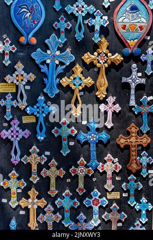 Display of Greek souvenirs religious icons on rack in downtown shopping ...