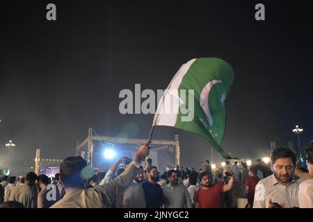 Light and firework shows are held outside Parliament to mark Pakistan ...