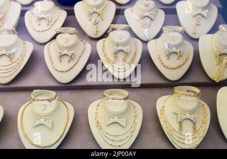 Variety of gold jewelry displayed for sale Stock Photo - Alamy