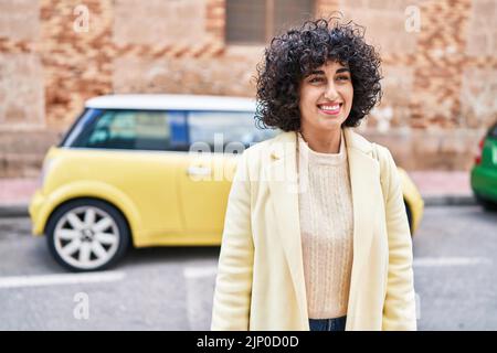 Young middle east woman excutive smiling confident standing with arms ...