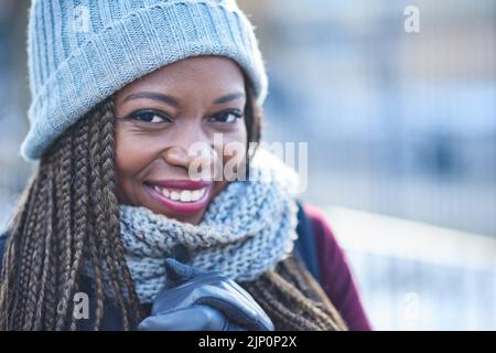 Hello winter. Portrait of happy modern female in sweater, mittens, hat ...