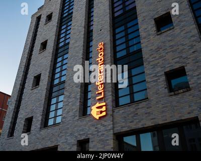 Berlin, Germany, Delivery company Lieferando building with tall banner ...