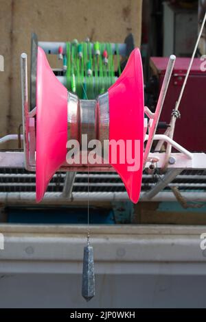Colourful squid jigging machine Stock Photo - Alamy