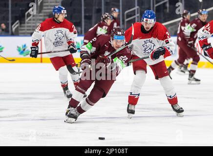 Czechia's David Spacek (3) chases Latvia's Sandis Vilmanis (22) during ...
