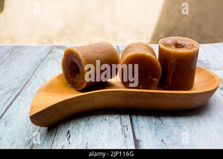 selective focus of brown sugar cubes in wooden tray Stock Photo - Alamy