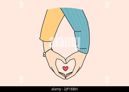 Couple holding hands show heart sign with fingers. Man and woman ...