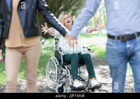 Disabled woman in wheelchair screaming or crying Stock Photo - Alamy