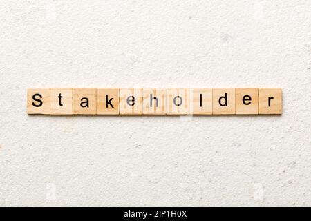 Stakeholder word written on wood block. Stakeholder text on wooden ...