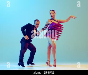 Man and woman, professional tango dancers in stylish, beautiful stage ...