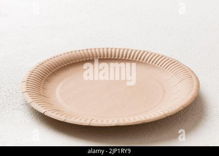 Perspective view of eco paper plate on wooden background. Empty space ...