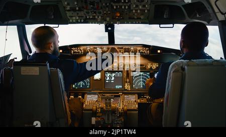 Captain and copilot switching power engine buttons on dashboard and ...