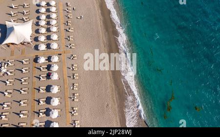 Aerial photo of a beach bar in the shore of Agiokampos beach , Greece ...