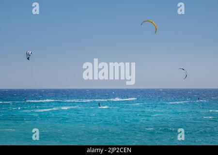 Kitesurfers surfing in the sea of Agiokampos beach, Greece Stock Photo ...