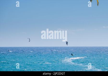Kitesurfers surfing in the sea of Agiokampos beach, Greece Stock Photo ...