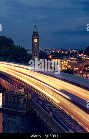 A vertical shot with long exposure of a subway tunnel with the lights ...