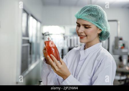 Food and drink factory ISO audit quality control team working, hygiene check and process ...