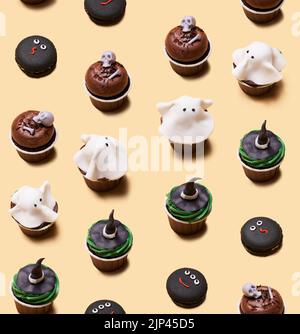 Seamless pattern of Halloween treat - macaron decorated monster faces ...