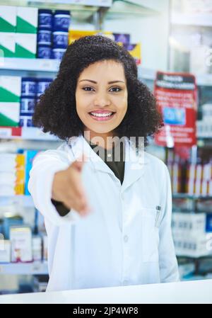 Brunette woman working at pharmacy drugstore holding cough syrup angry ...