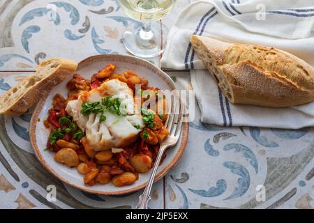 Spanish dish of cod with butter beans, tomatoes and chorizo Stock Photo ...