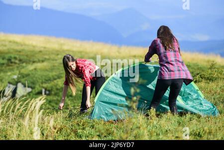 Helpful to have partner for raising tent. Attach necessary structural ...