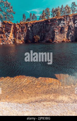 Flooded and abandoned quarry with an infrared filter Stock Photo - Alamy