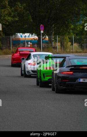 A vertical shot of a Porsche car on a race track in Leipzig, Germany ...