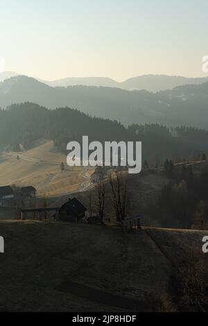 A vertical shot of a beautiful landscape with forested mountains Stock ...