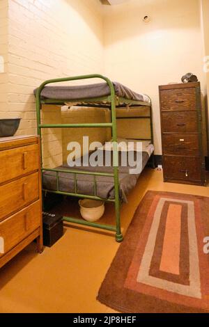 Small room with bunk beds and desk Stock Photo - Alamy