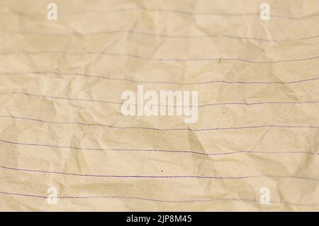 crumpled paper closeup with horizontal lines lies crumpled on another ...