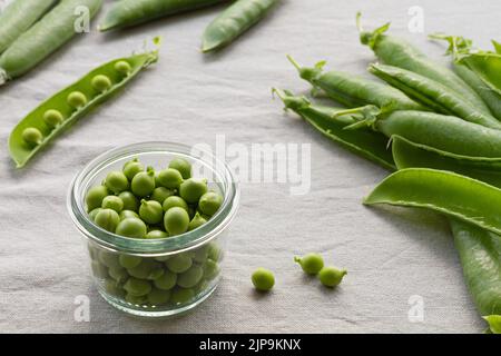 peeling, pea family, pea, pea families, peas Stock Photo - Alamy