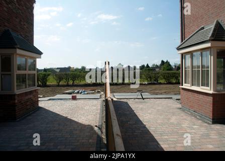 Wall between and windows of newly constructed houses building site ...